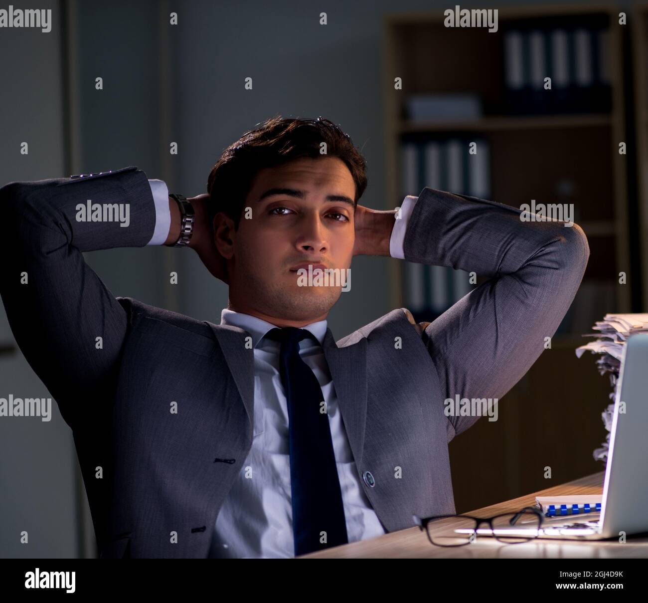 The man staying in the office for long hours Stock Photo - Alamy
