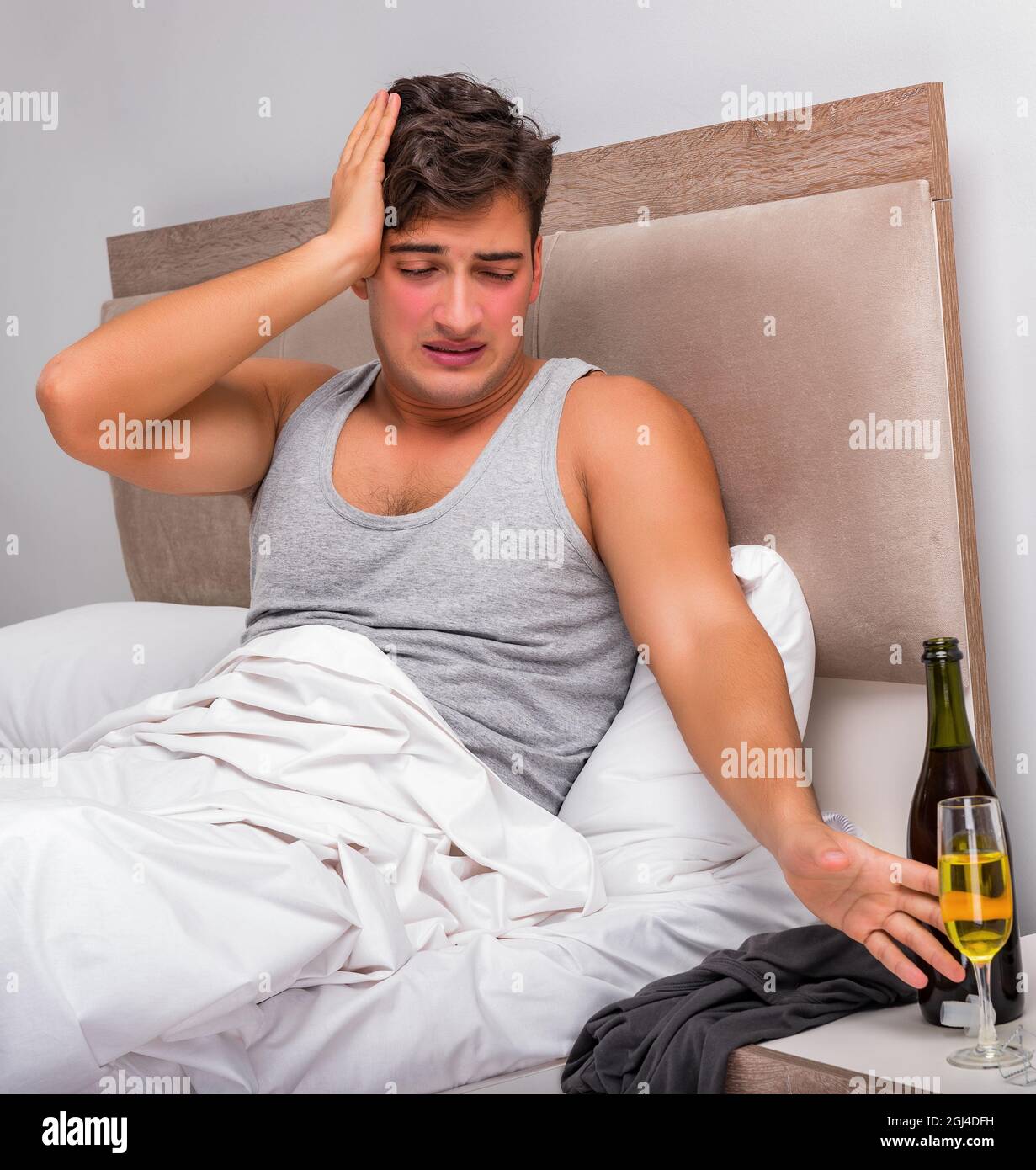 The man in the bed after party - hangover concept Stock Photo - Alamy