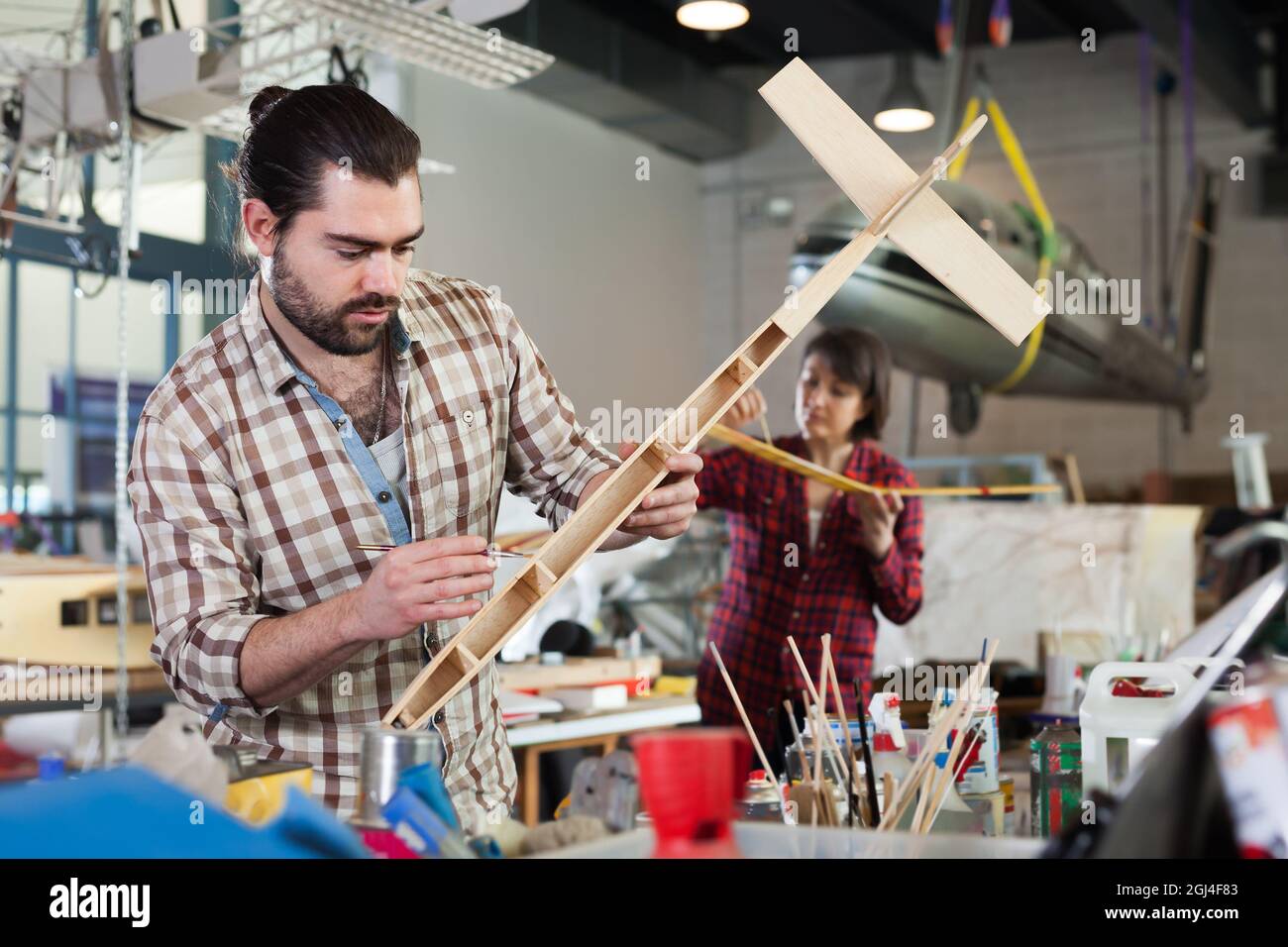 Adult man working on creating of airplane models Stock Photo - Alamy