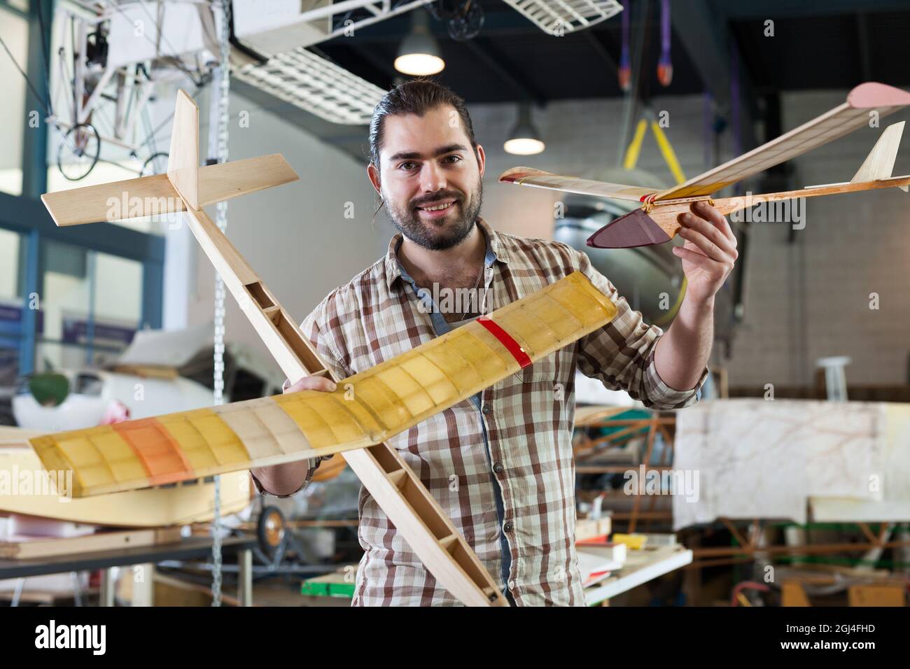Man having fun with plane models Stock Photo - Alamy