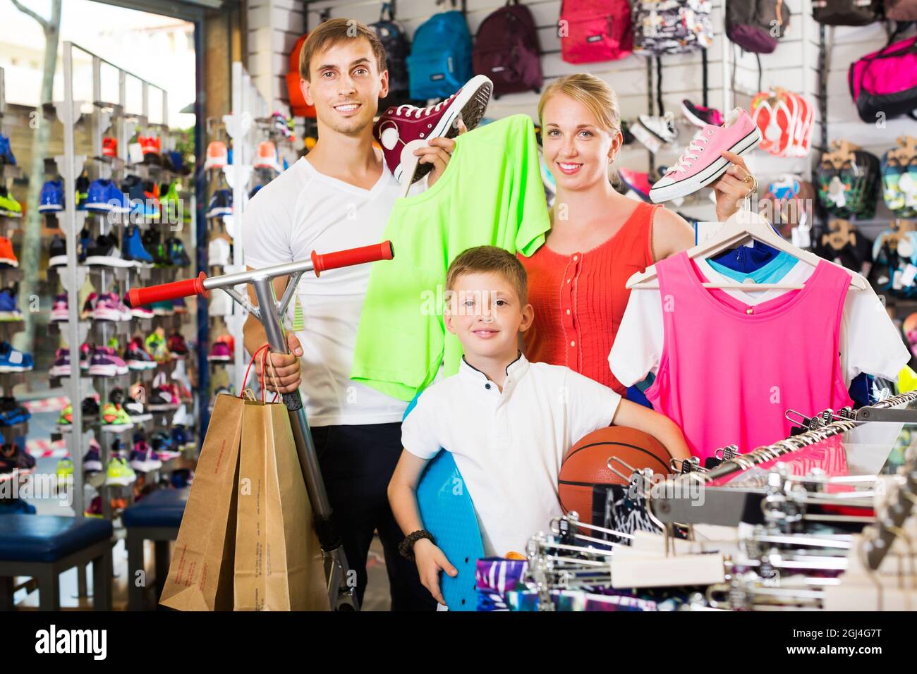 Family picking various clothing Stock Photo - Alamy