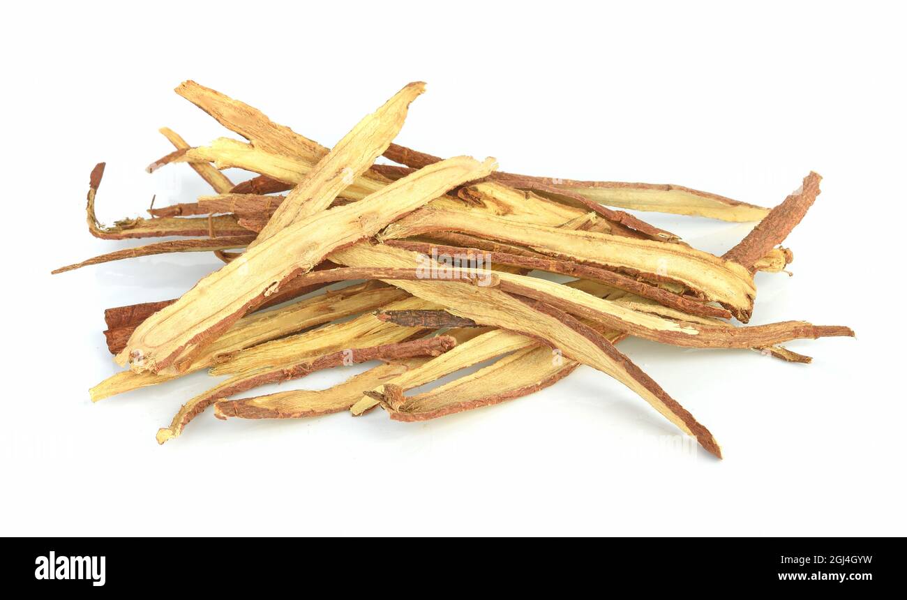 Slice Licorice roots on white background Stock Photo - Alamy