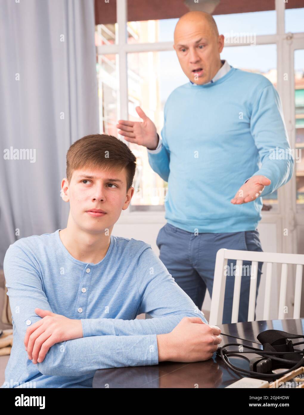 Man scolding son at home Stock Photo - Alamy