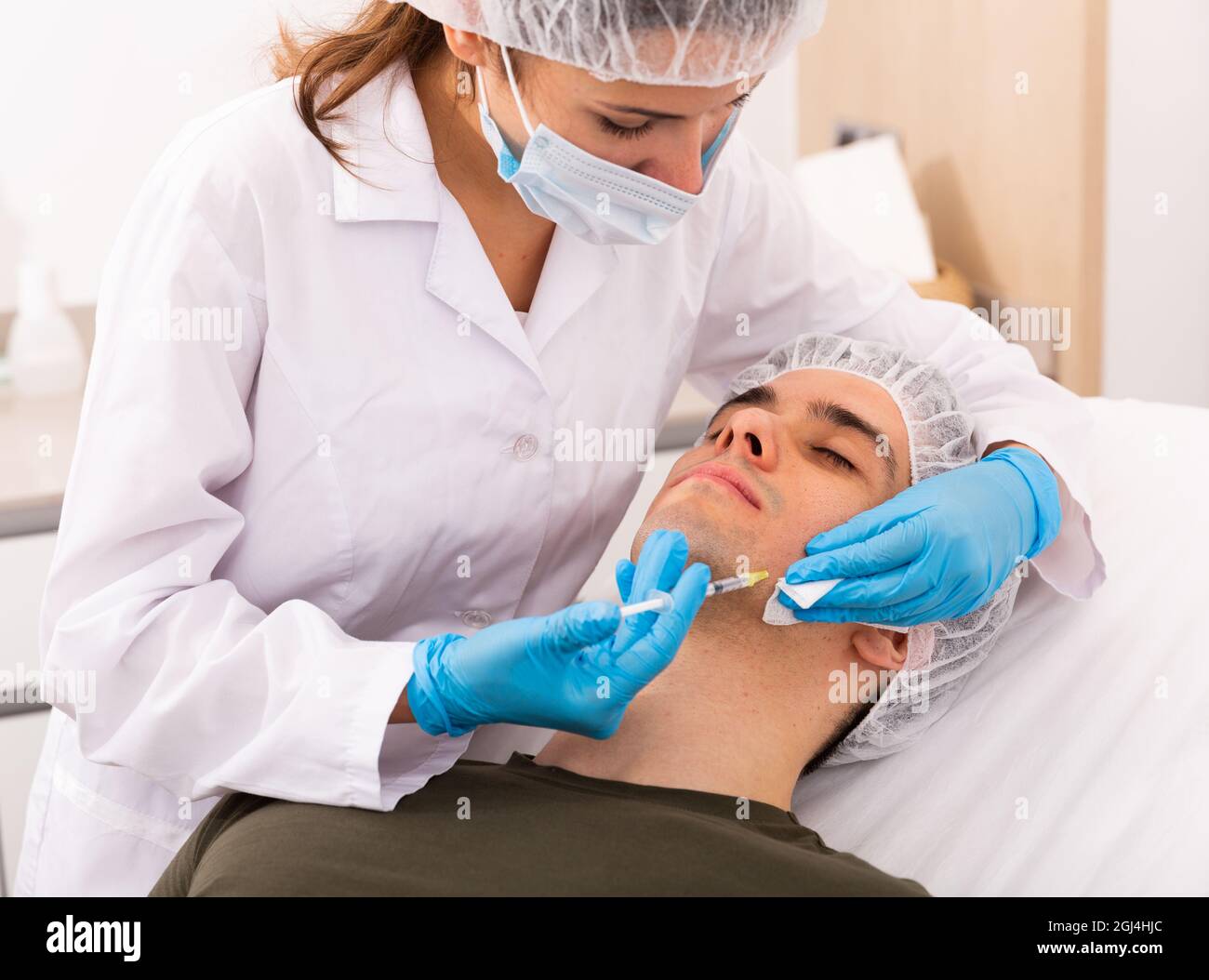 Male patient getting face injections Stock Photo - Alamy