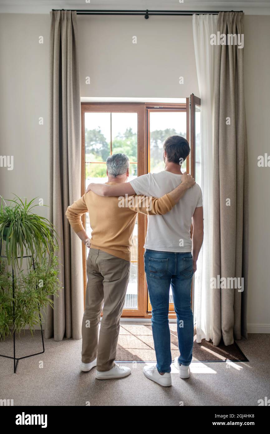 A young man spending time with his dad and feeling good Stock Photo - Alamy