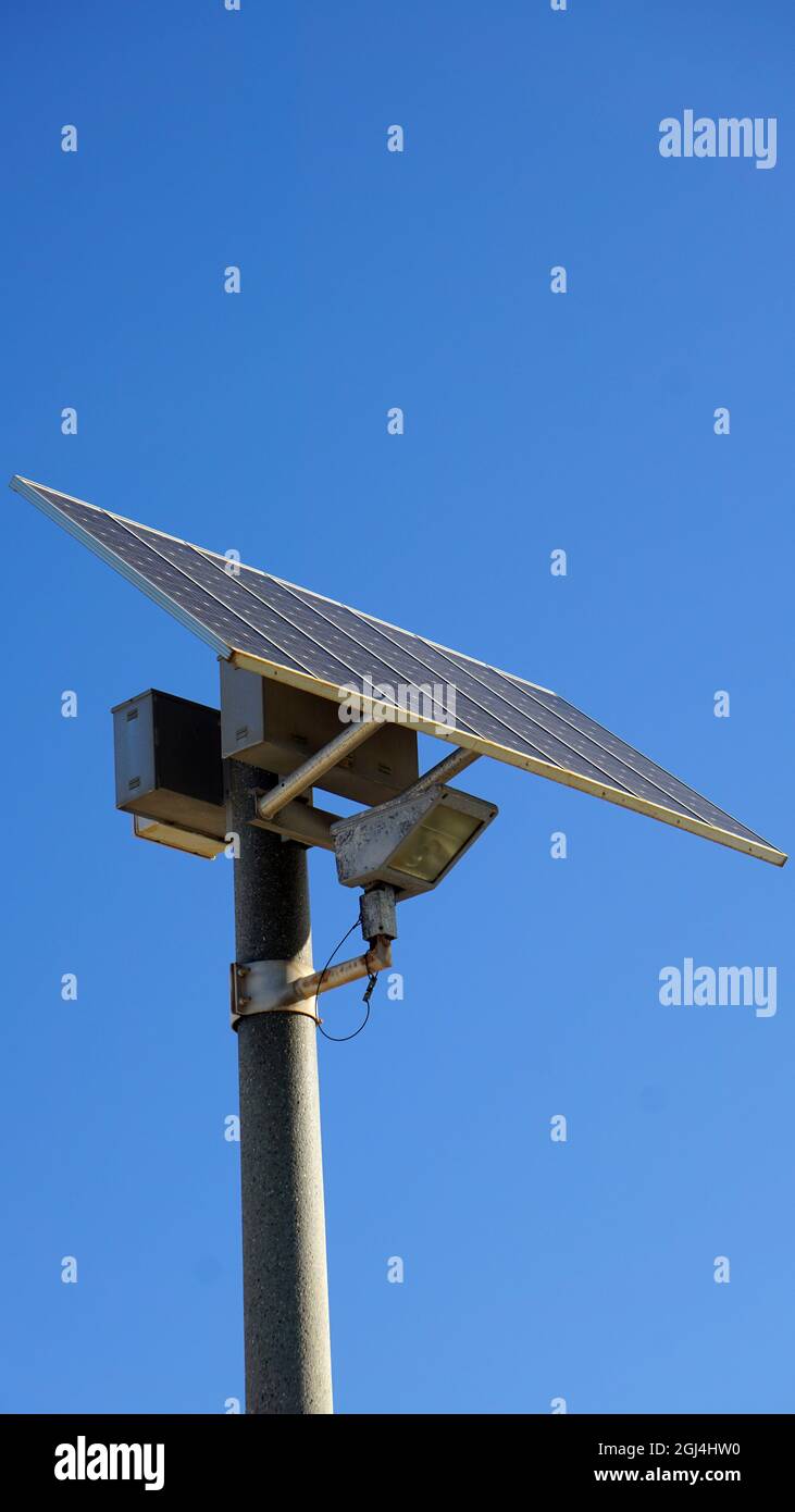Industrial light towers powered by solar panels Stock Photo - Alamy