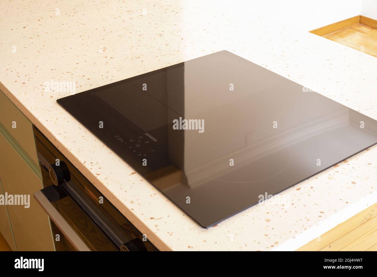 Closeup of the black electric contemporary stove on the kitchen counter ...