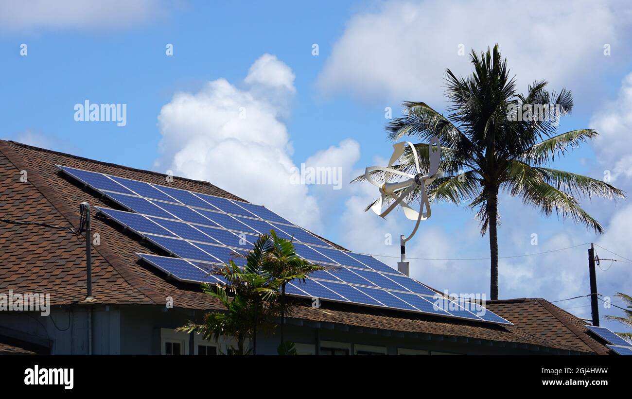 Rooftop solar panels on a house in Hawaii help offset electricity costs ...