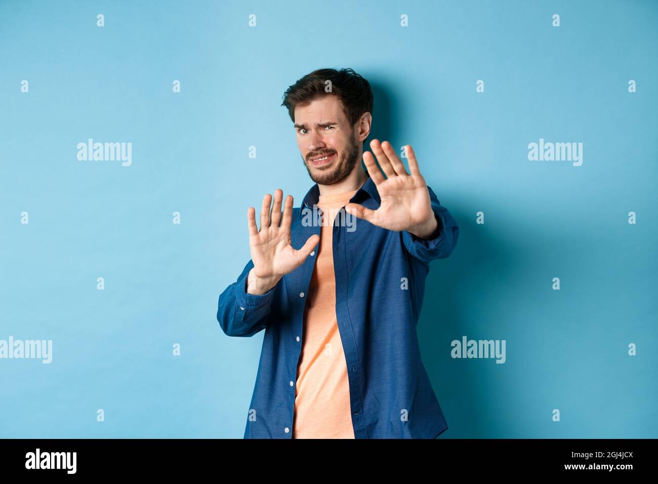 Guy cringe from something disgusting or embarrasssing, stretching out ...