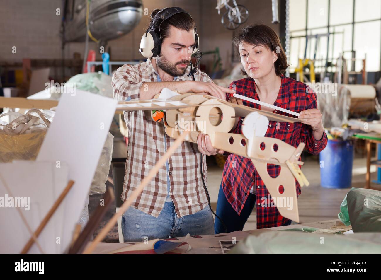 Team creating airplane models Stock Photo - Alamy