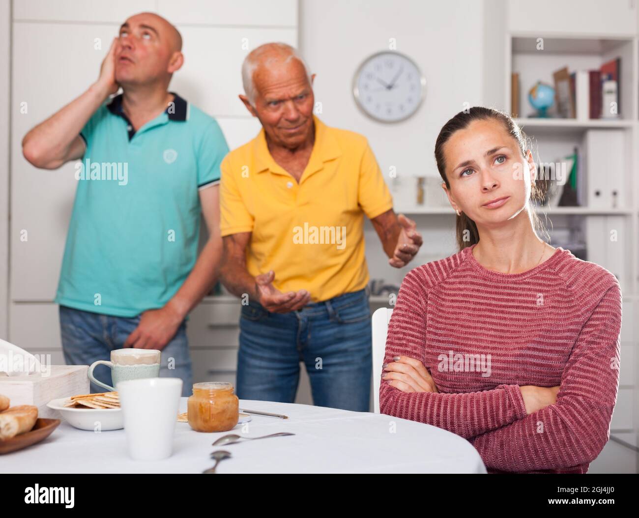 Elderly father together with his adult son scold the daughter-in-law at ...