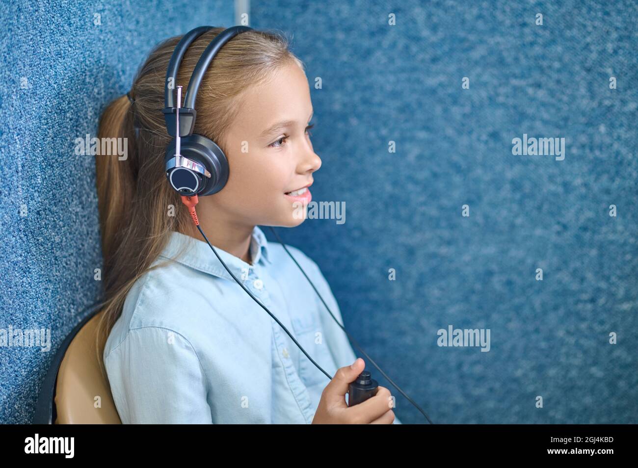 Girl undergoing hearing test at medical clinic Stock Photo - Alamy
