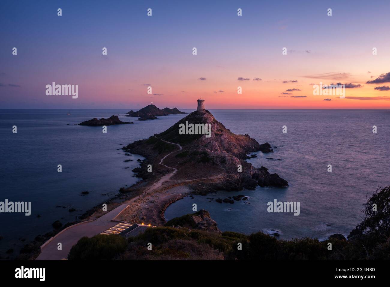 Sunset over the Genoese tower and lighthouse at Pointe de la Parata and ...
