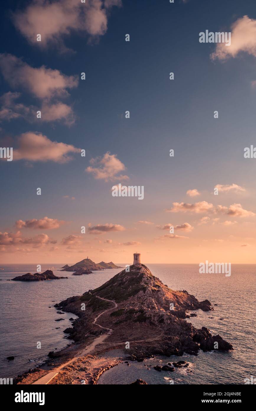Sunset over the Genoese tower and lighthouse at Pointe de la Parata and ...