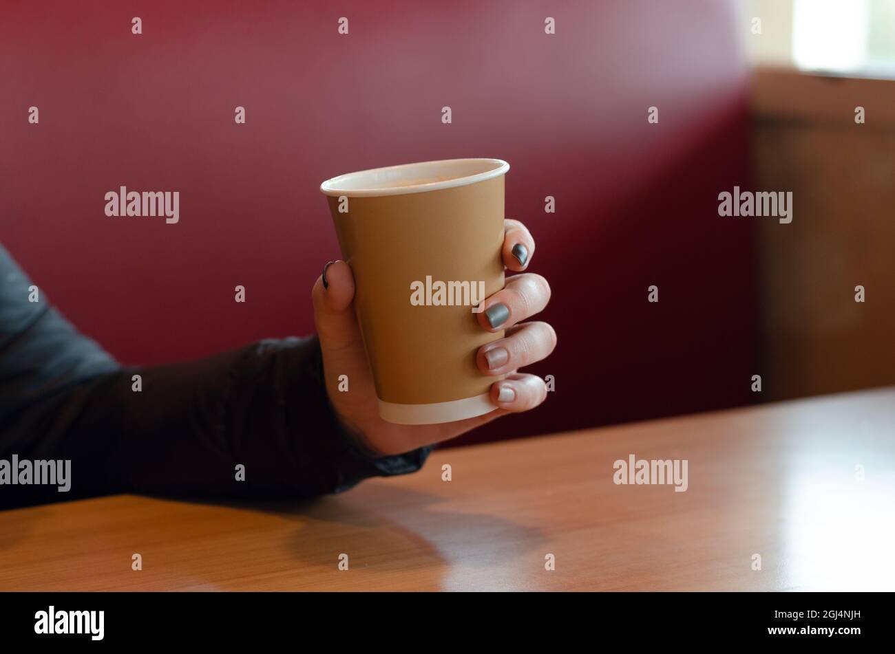 person drinking coffee in cafe. Girl taking a coffee. Drinking coffee ...