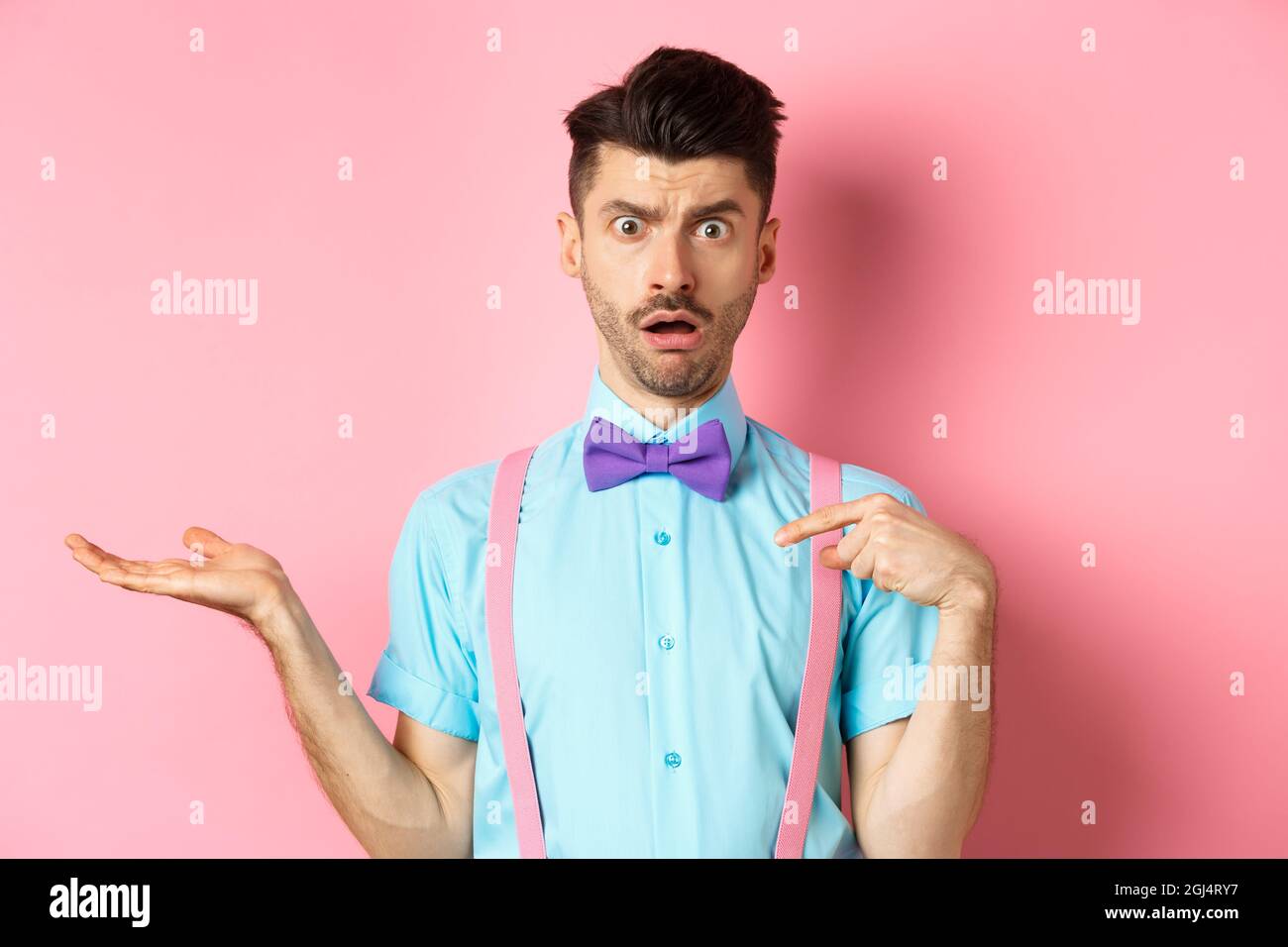 Shocked and confused guy pointing at himself with disbelief, being ...