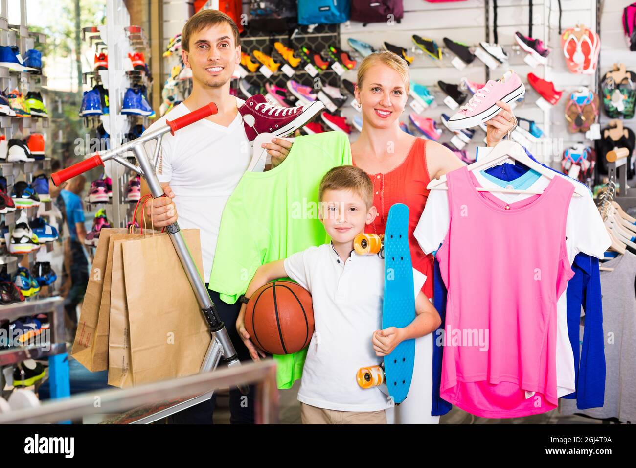 Family picking various clothing Stock Photo - Alamy