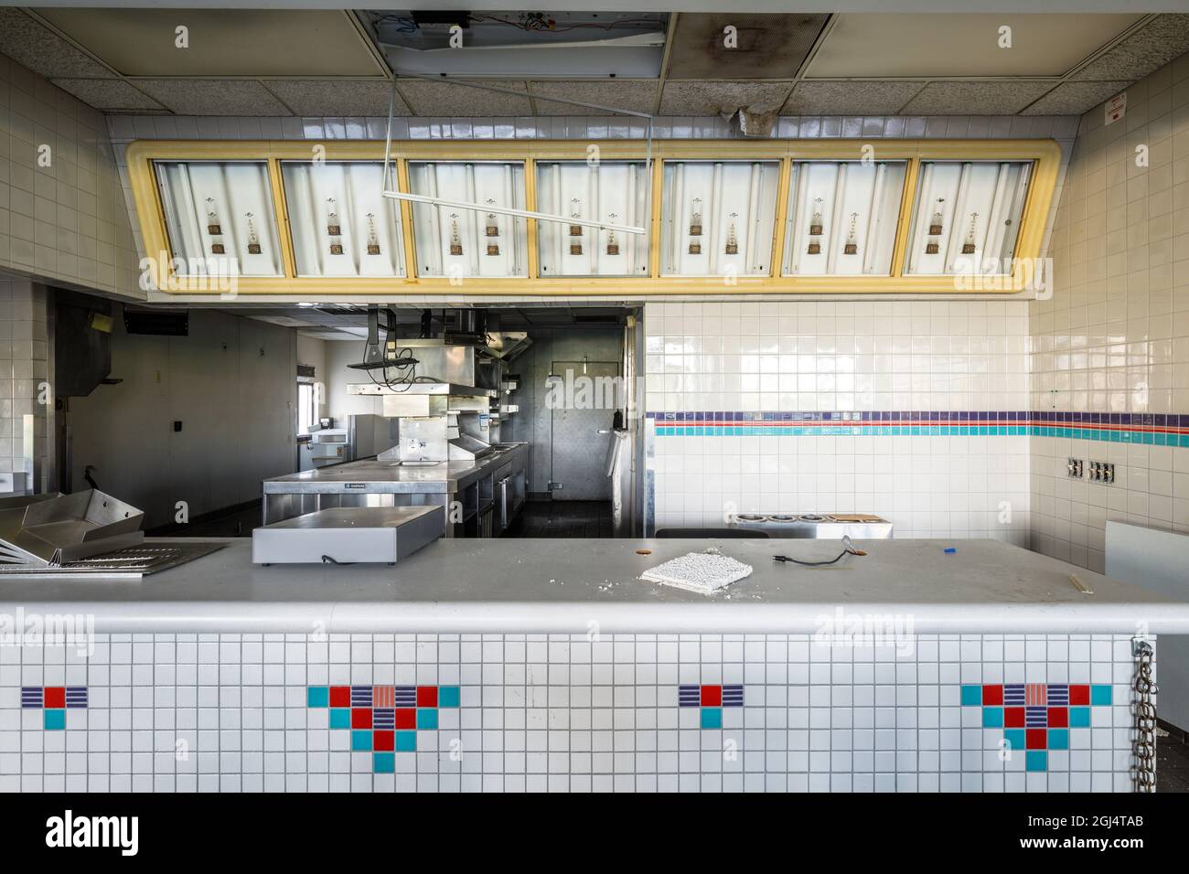 An abandoned retro Taco Bell main order counter. This building has ...