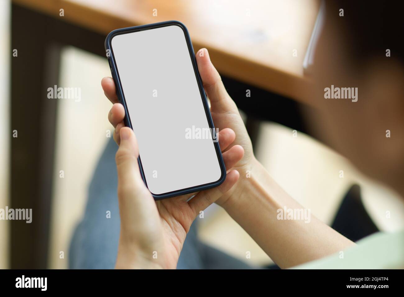 Close up, mobile blank screen mockup holding by young female, screen ...