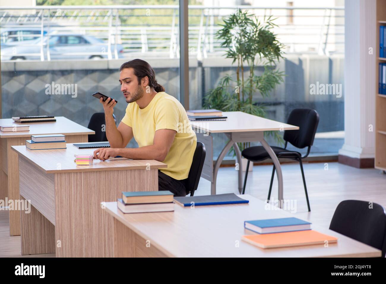 Male student sitting in the classroom Stock Photo - Alamy