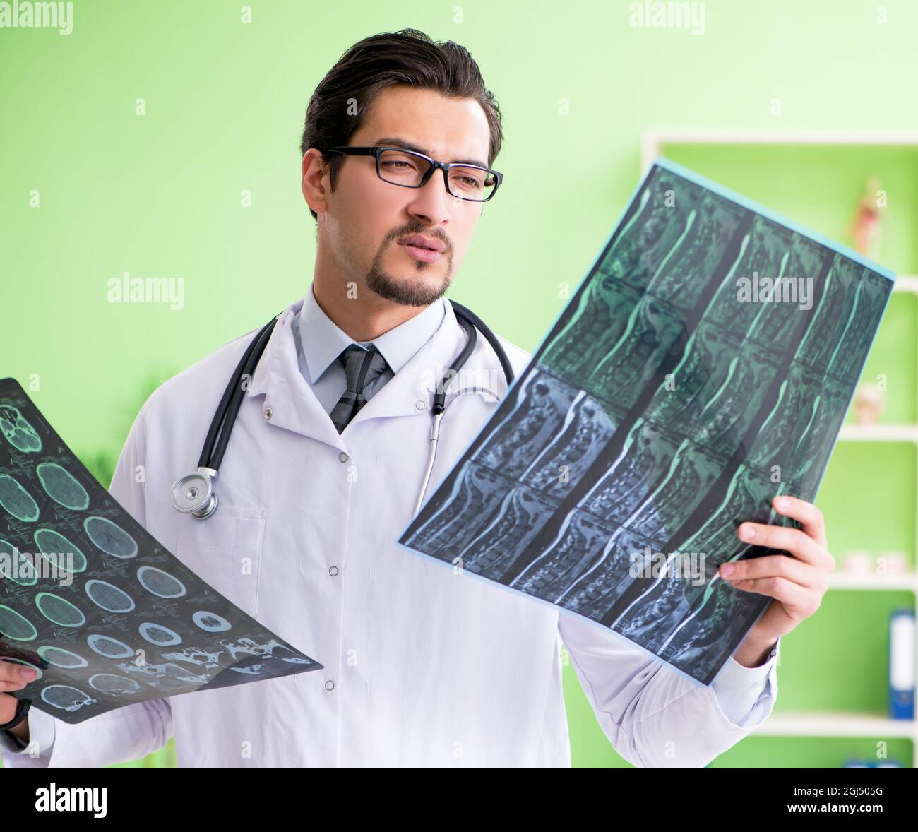 The doctor radiologist looking at x-ray scan in hospital Stock Photo ...