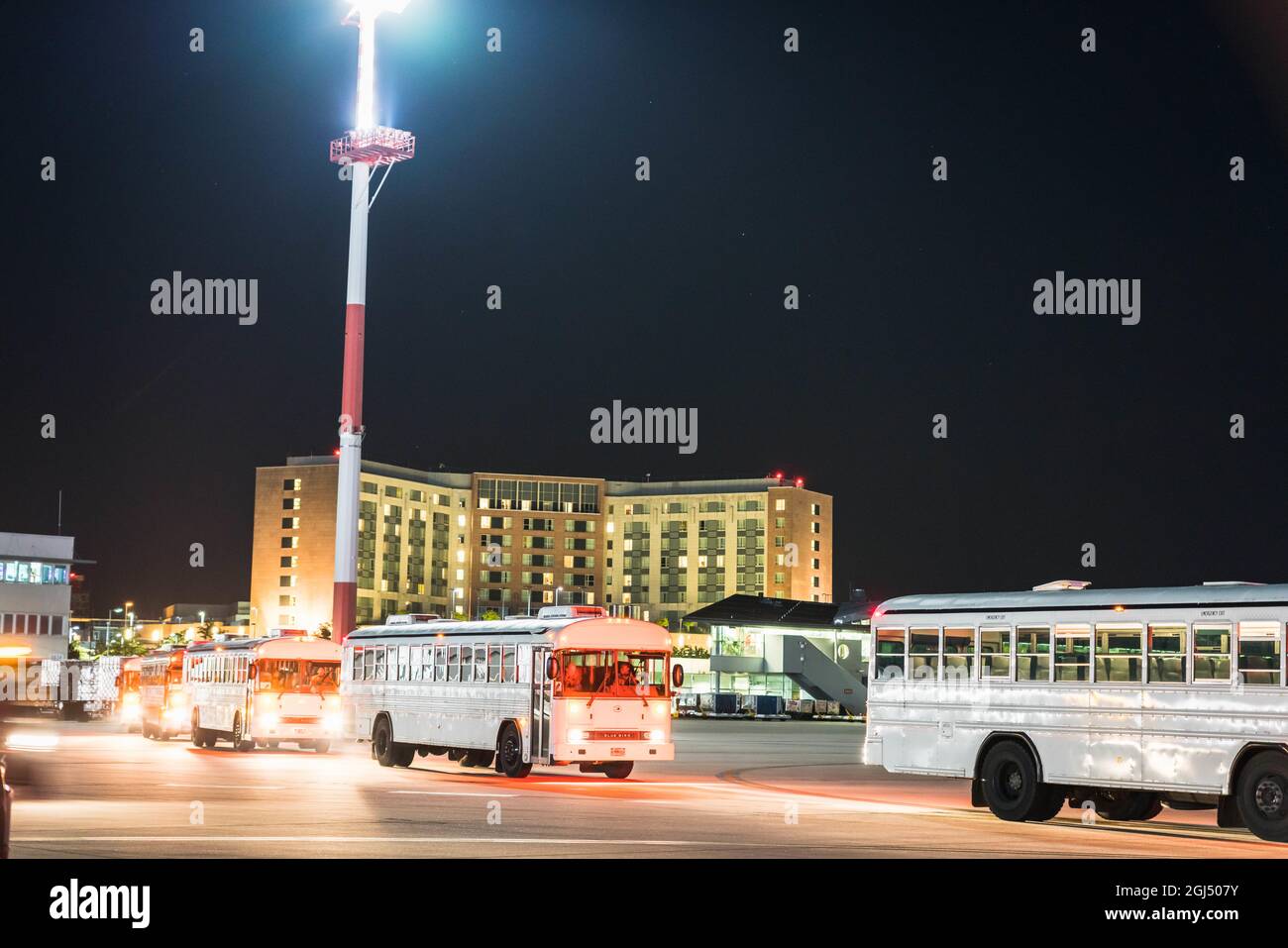 Evacuees from Afghanistan are transported from a terminal to an ...
