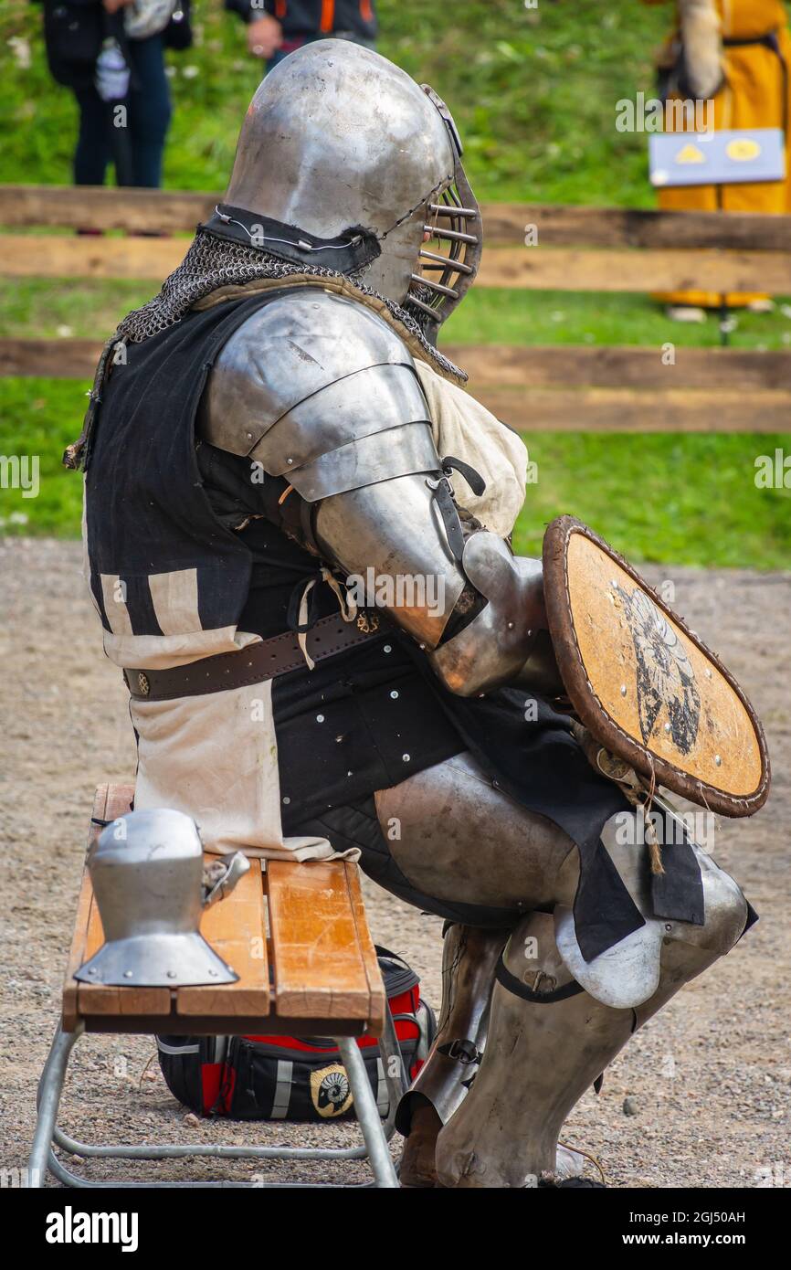 Medieval Combat Sport Fighter sitting on a bench before the fight at ...