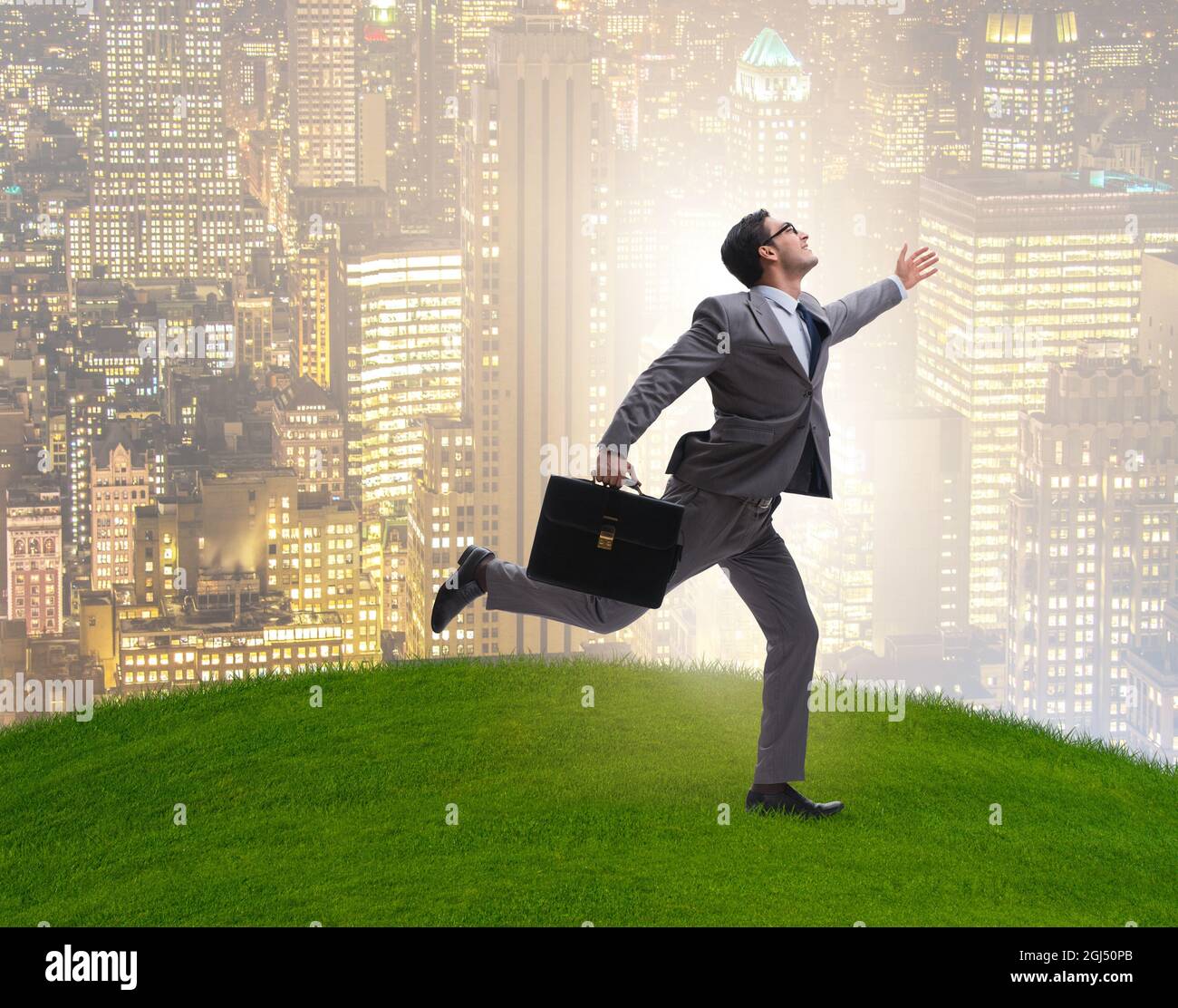The happy businessman running towards his goal Stock Photo - Alamy