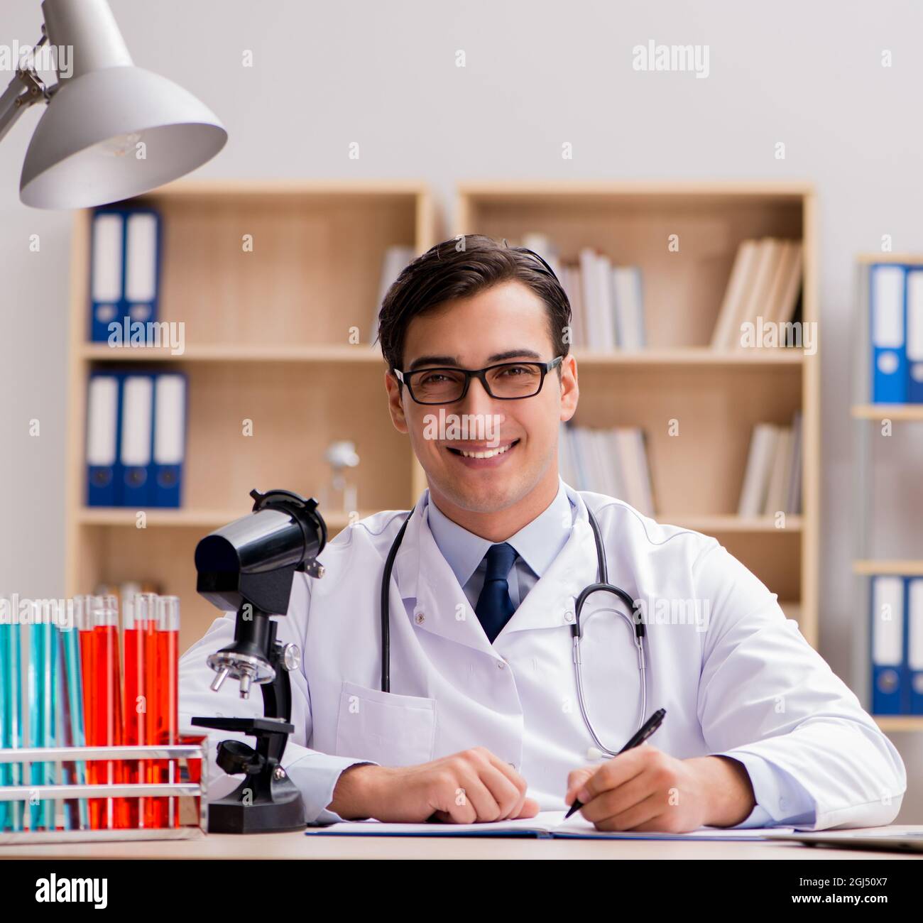 The man doctor working in the lab Stock Photo - Alamy