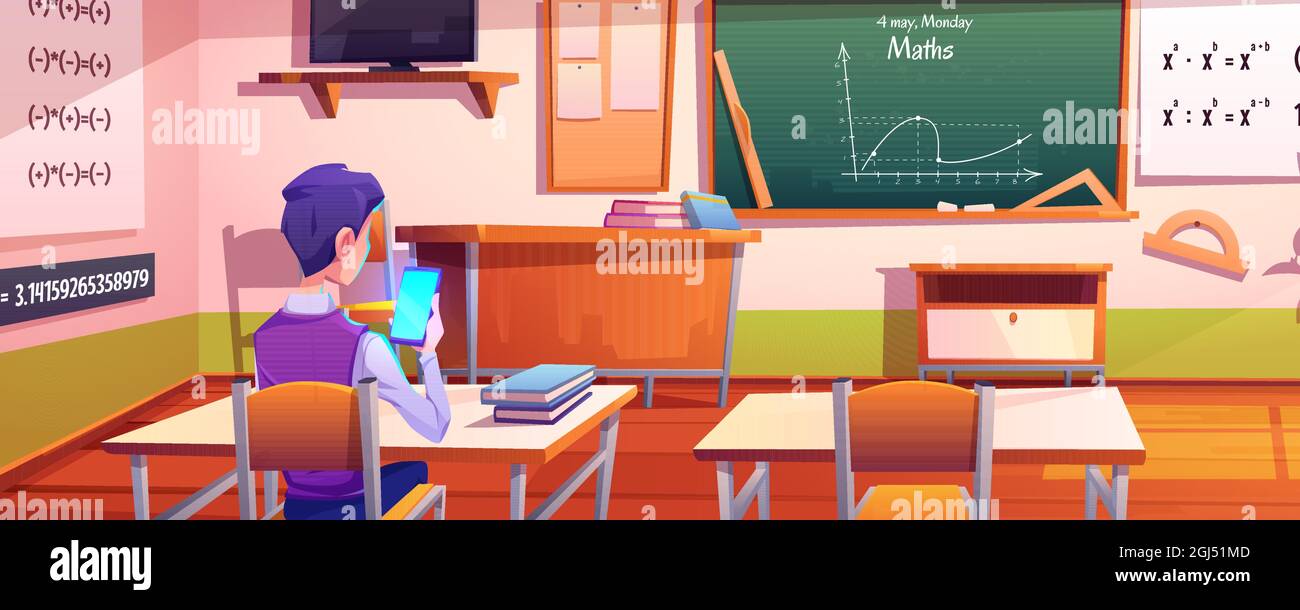 Student or school boy communicate by cell phone sitting at desk in ...