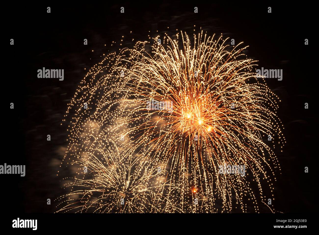 view on holiday fireworks in dark night sky Stock Photo - Alamy