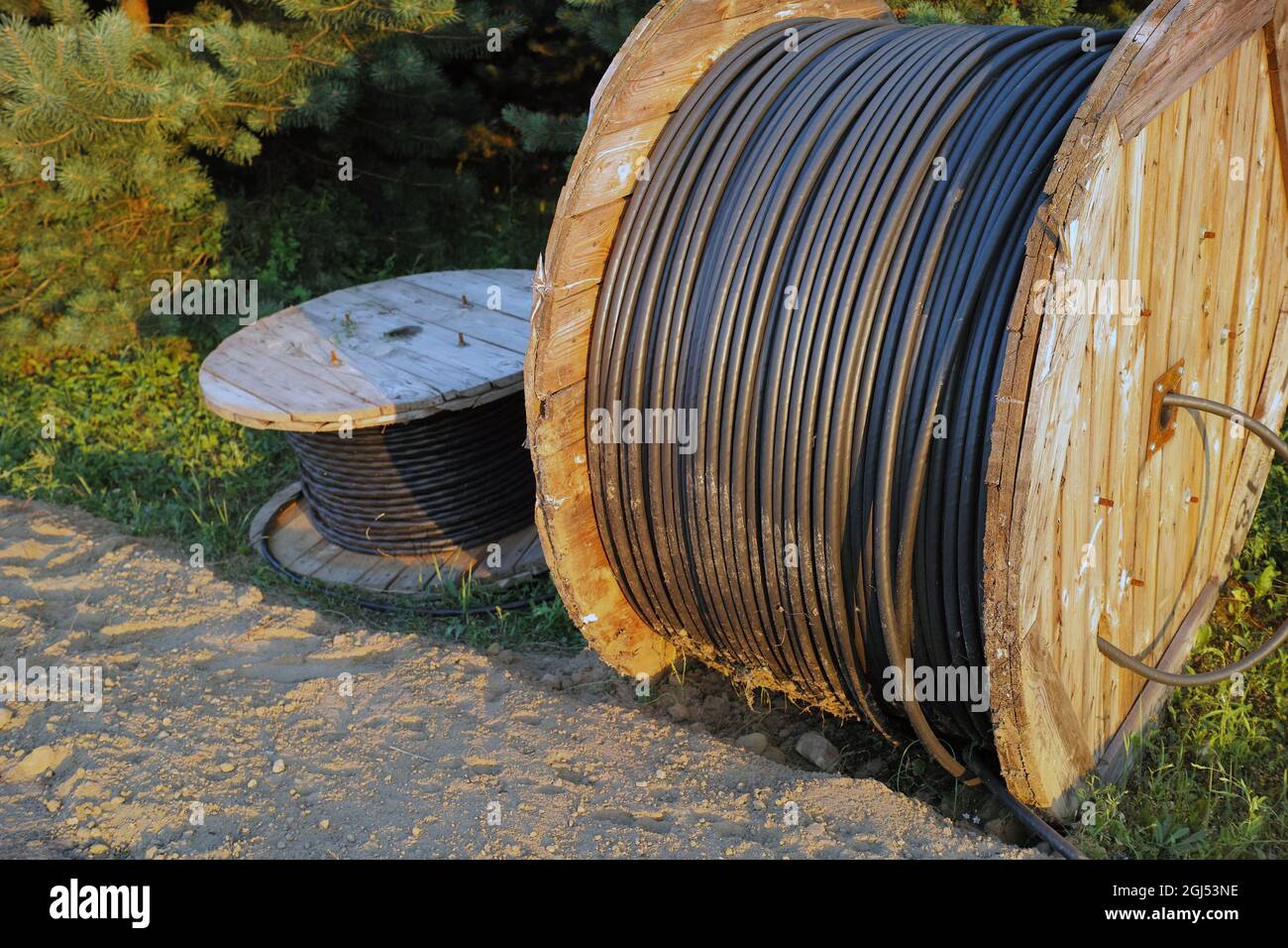 abandoned coils of electric cable, outdoor sunset shot Stock Photo - Alamy