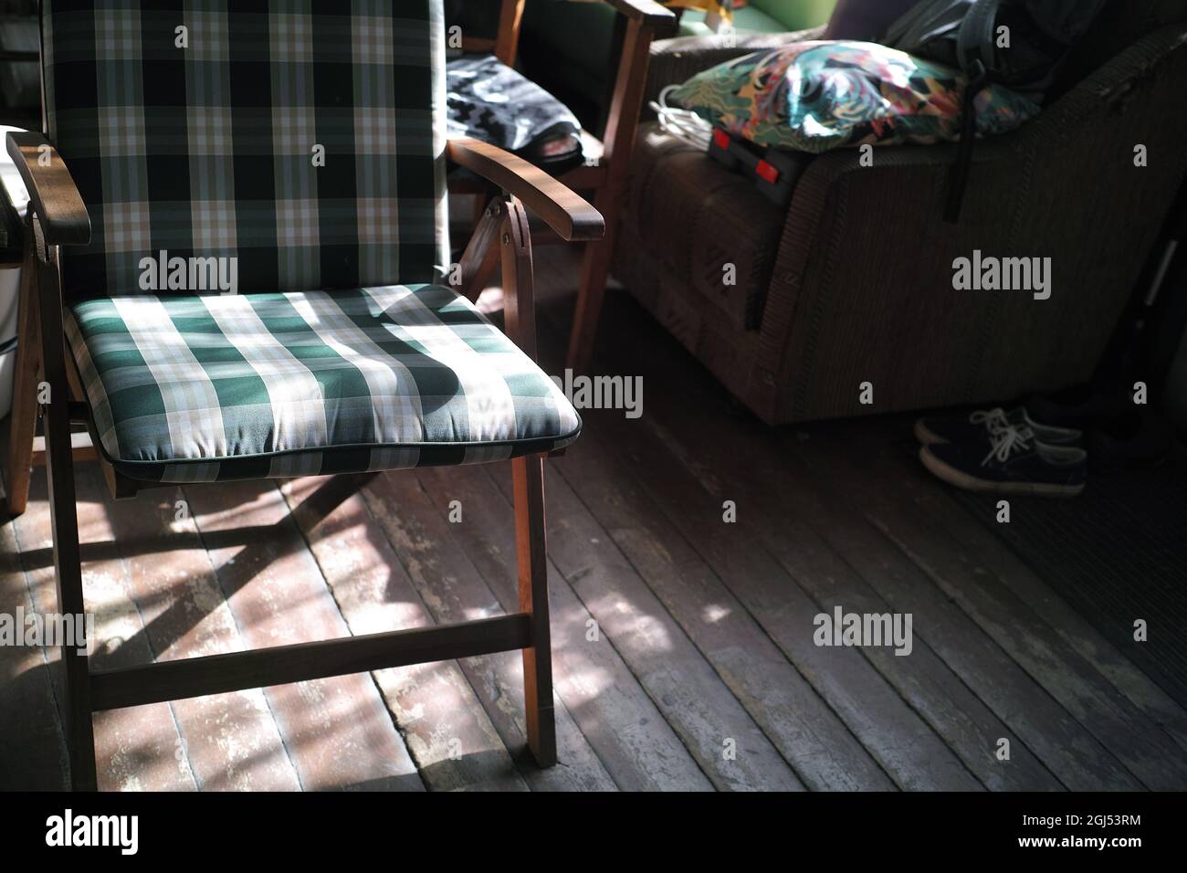 Interior of a messy loft with an arcmchair in the foreground Stock ...
