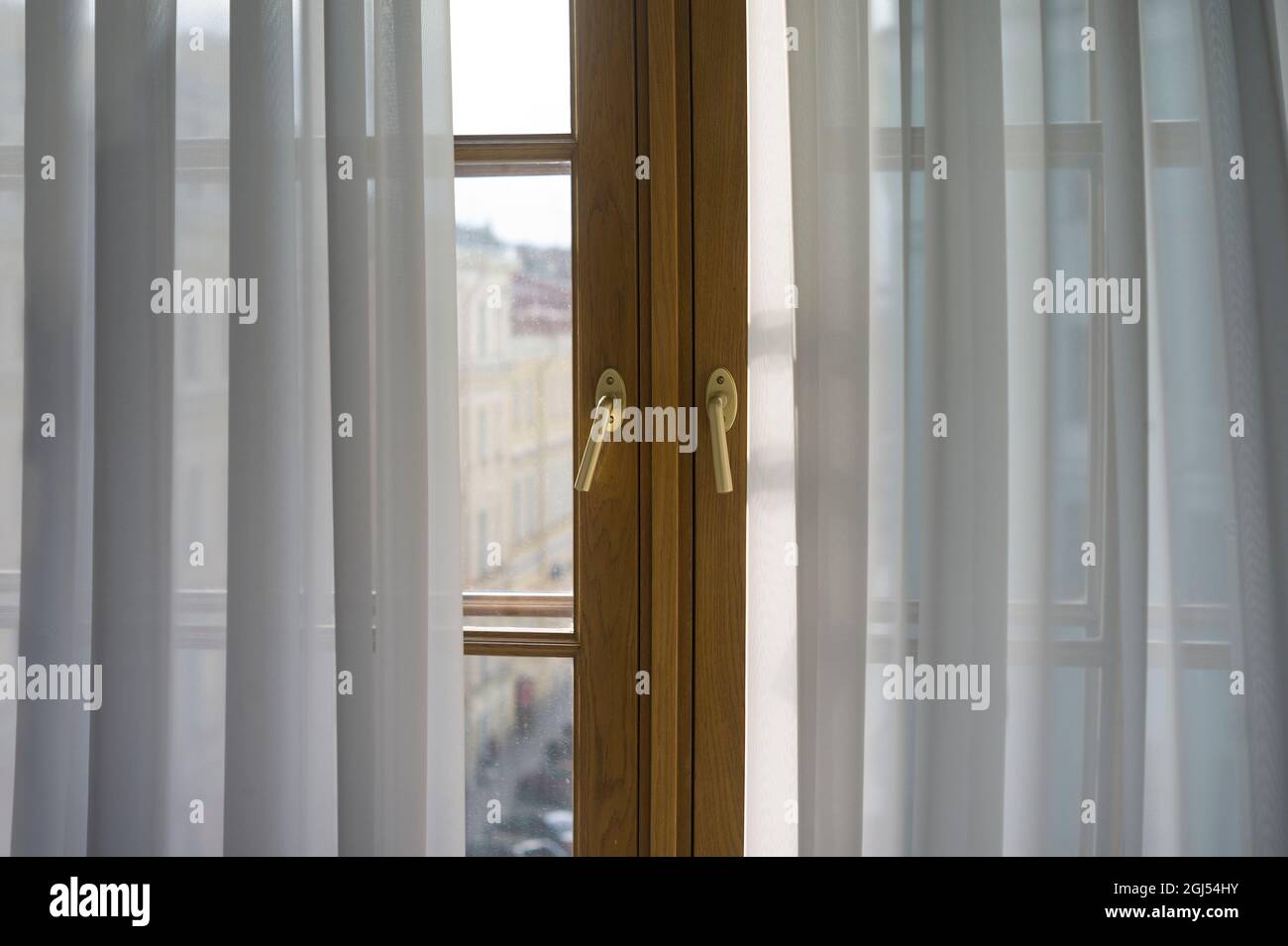 morning light through a window with half shot curtain Stock Photo - Alamy