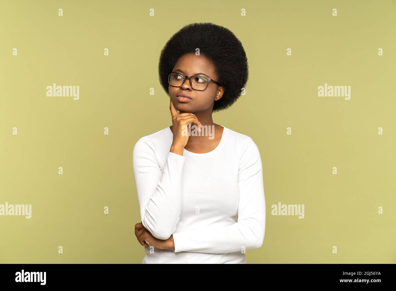 Pensive african woman thinking look away touching hand on chin ponder ...