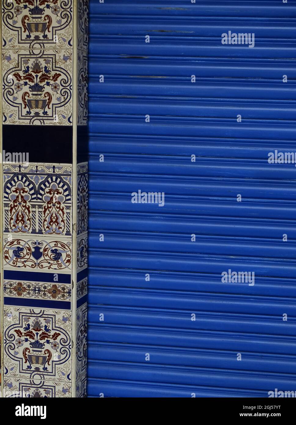 Blue steel gate texture with a byzantine ornament on the wall on the ...