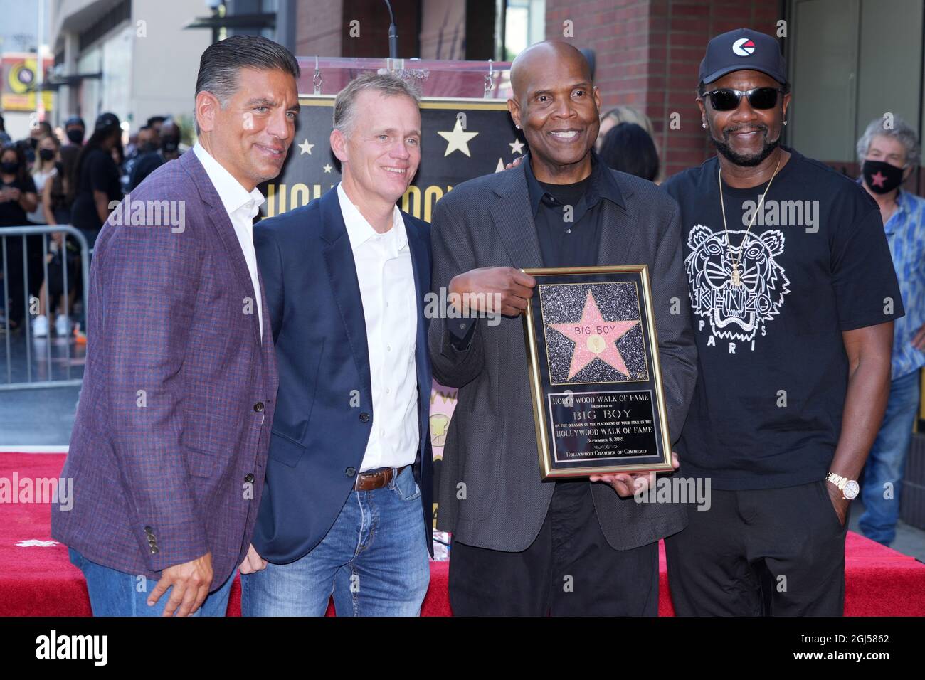 Radio personality Kurt Alexander aka Big Boy (second from right) poses ...