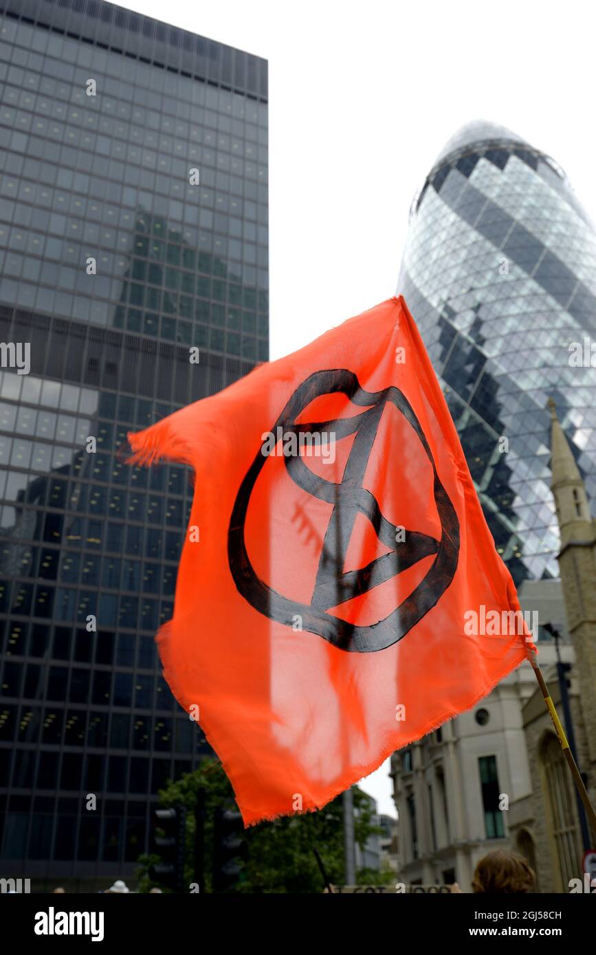 London, UK. Extinction Rebellion flag at aclimate protest in the City ...