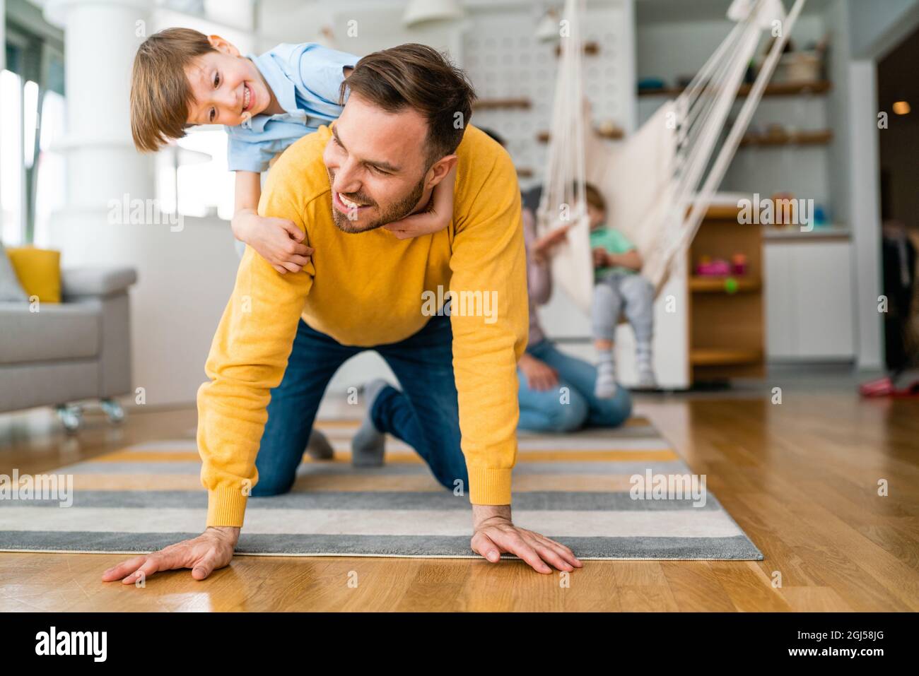 Happy family with children playing and cuddling at home Stock Photo - Alamy