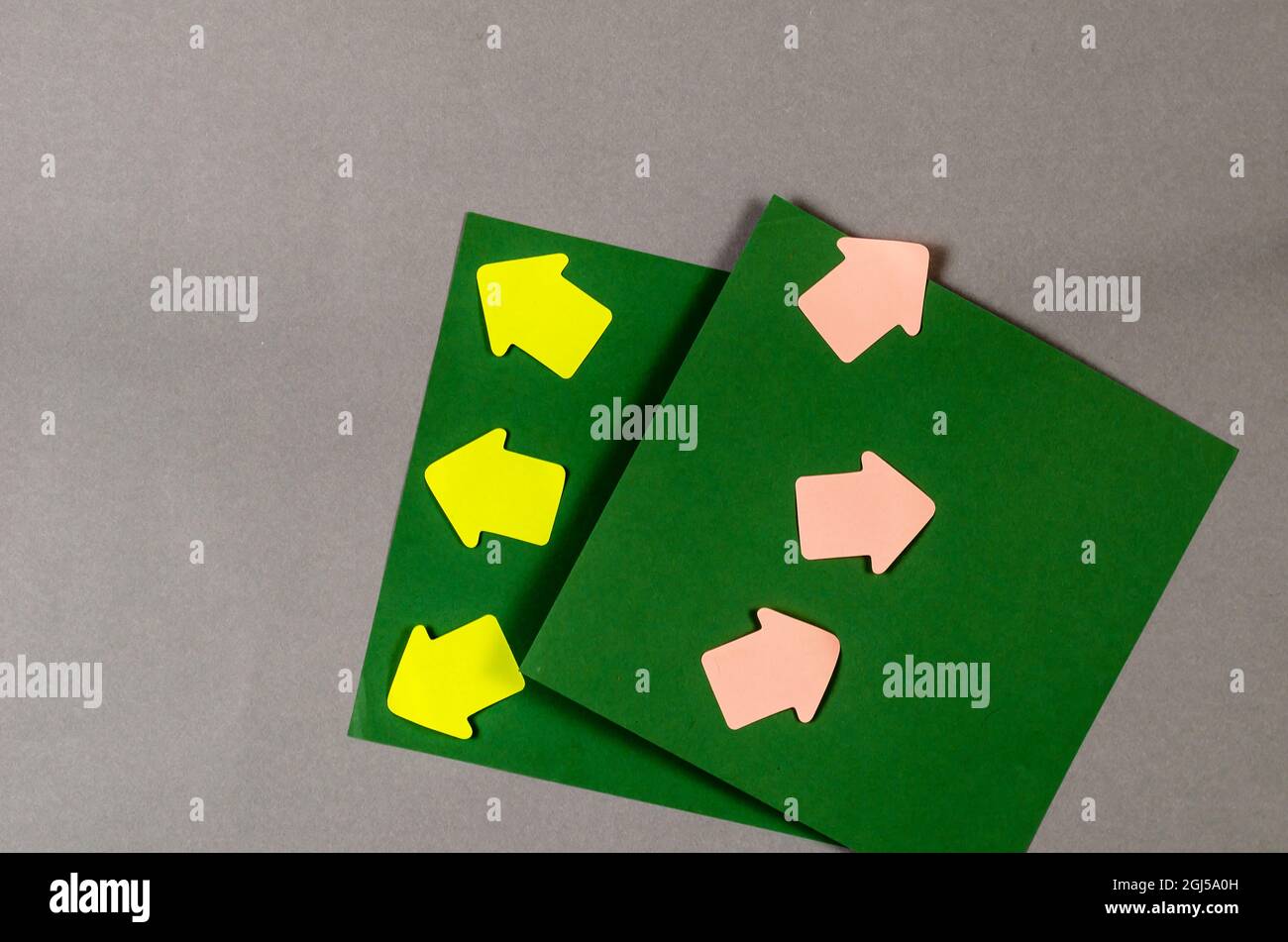 Square sheets of paper and bookmark arrows against a gray backgr Stock ...
