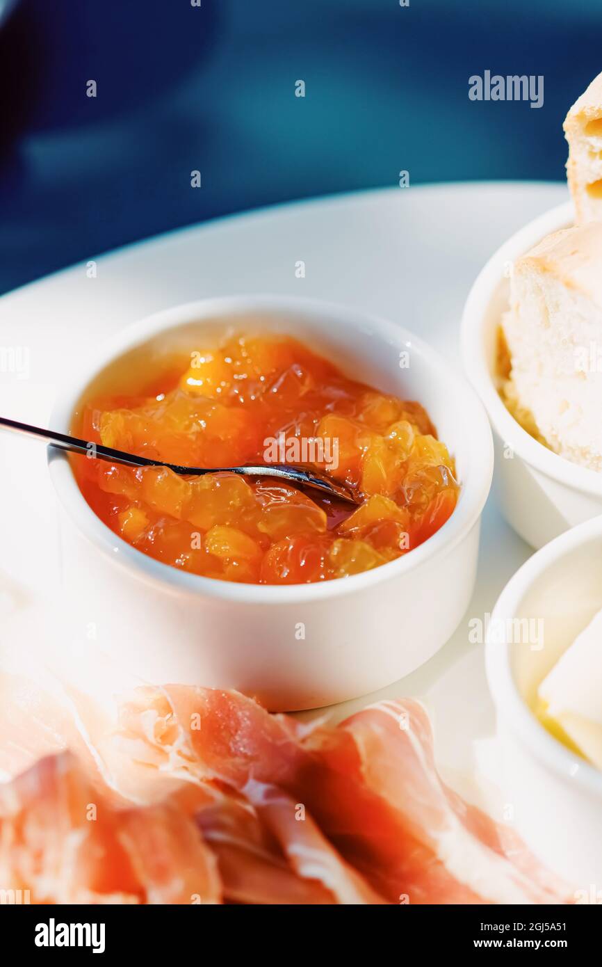 Breakfast outdoors in summer, ham, jam, butter and ham Stock Photo - Alamy