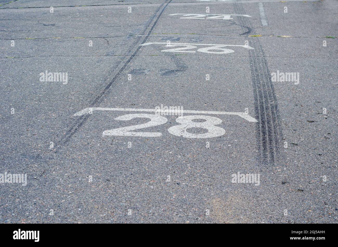 White numbers are painted on the pavement. Starting places for k Stock ...