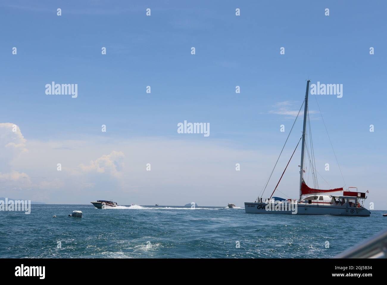 Boating near tropical islands waves and splashes Stock Photo - Alamy