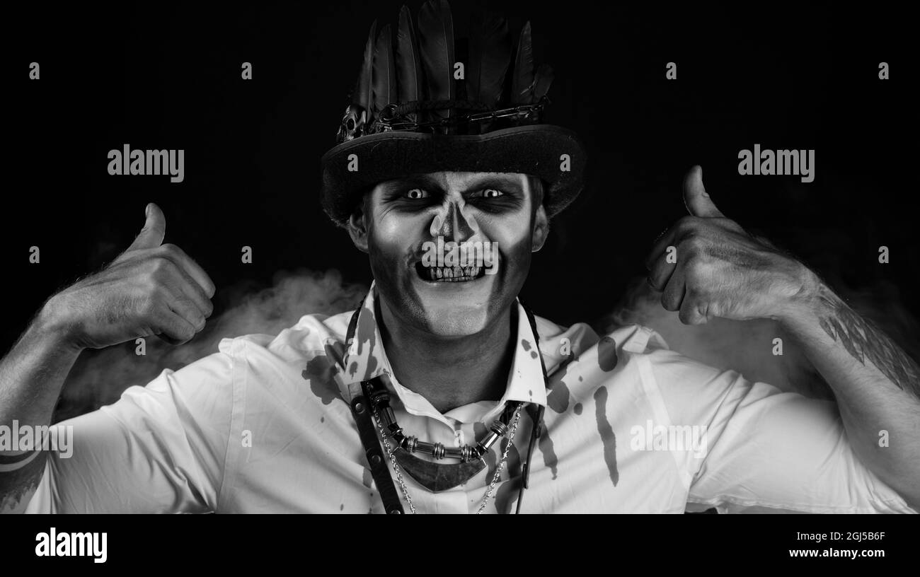 Frightening smiling man in skeleton Halloween costume showing thumbs up ...