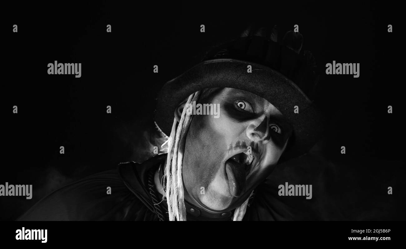 Sinister, crazy man with skeleton makeup. Guy making angry faces ...