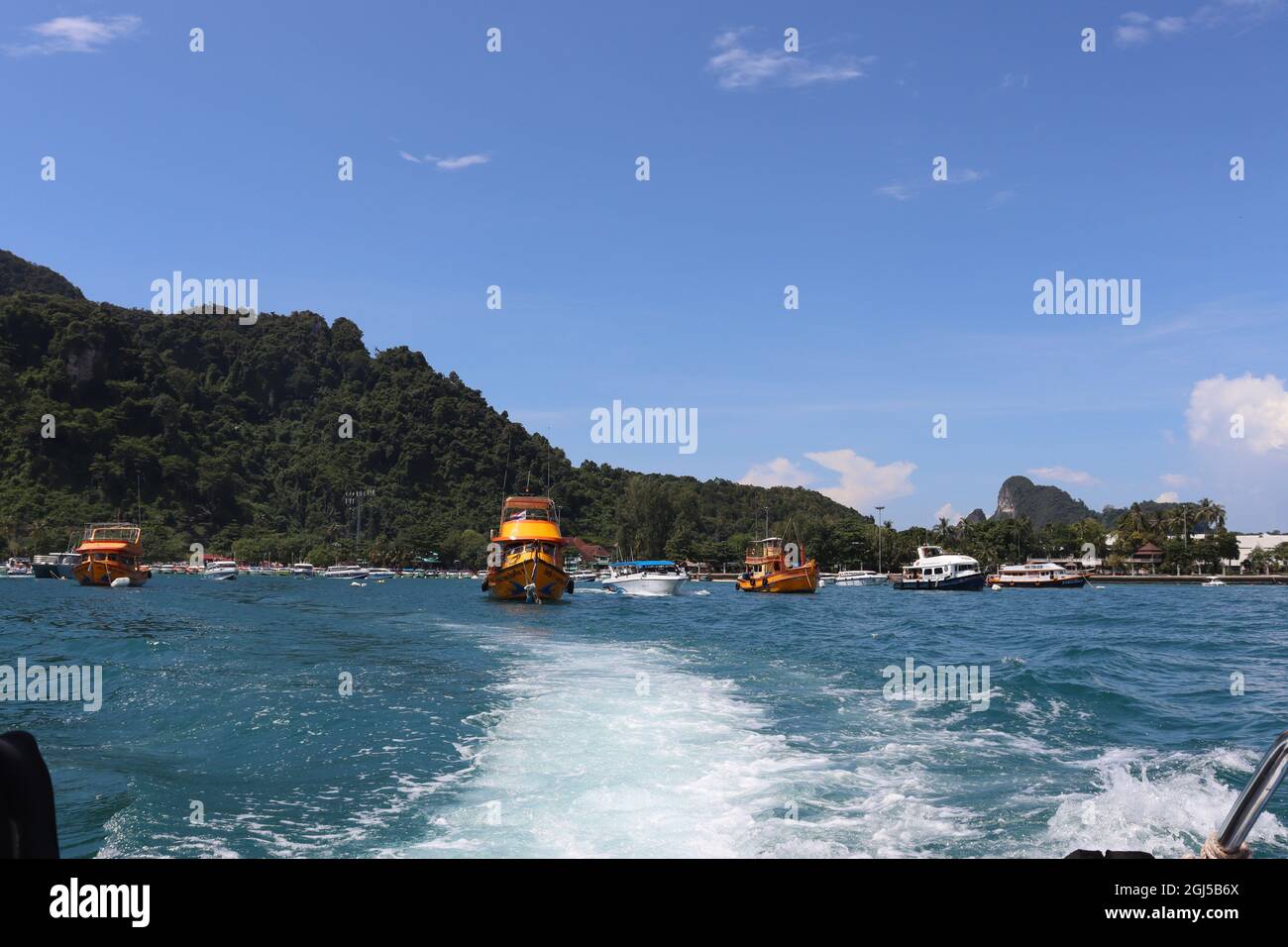 Boating near tropical islands waves and splashes Stock Photo - Alamy
