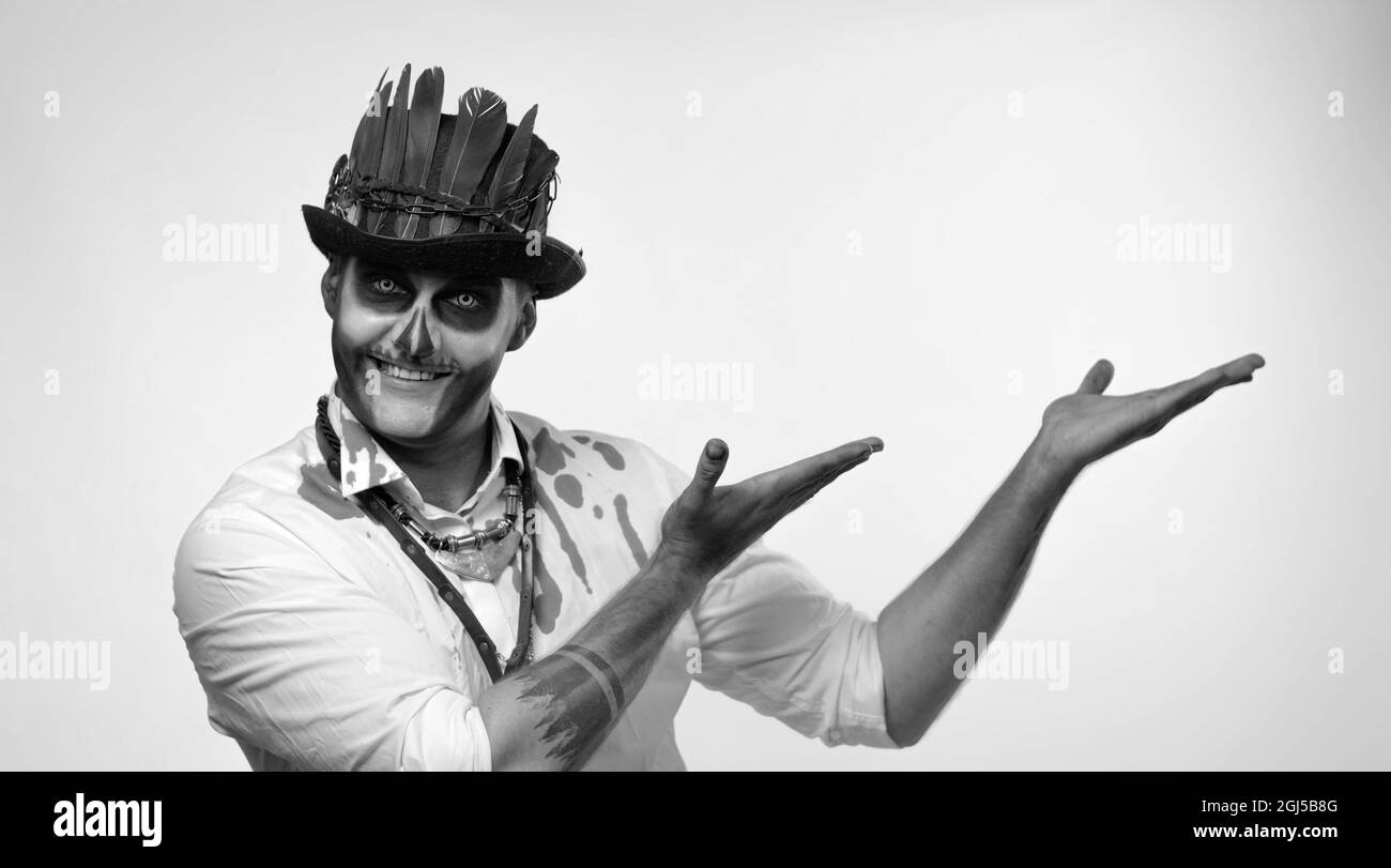 Sinister man with horrible Halloween skeleton makeup trying to scare ...