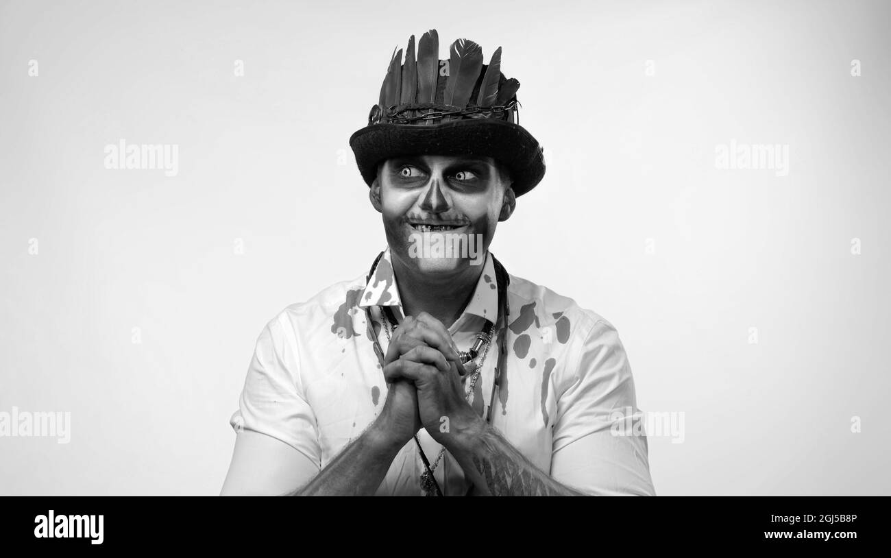 Man in skeleton Halloween costume. Cunning guy in creepy makeup with ...