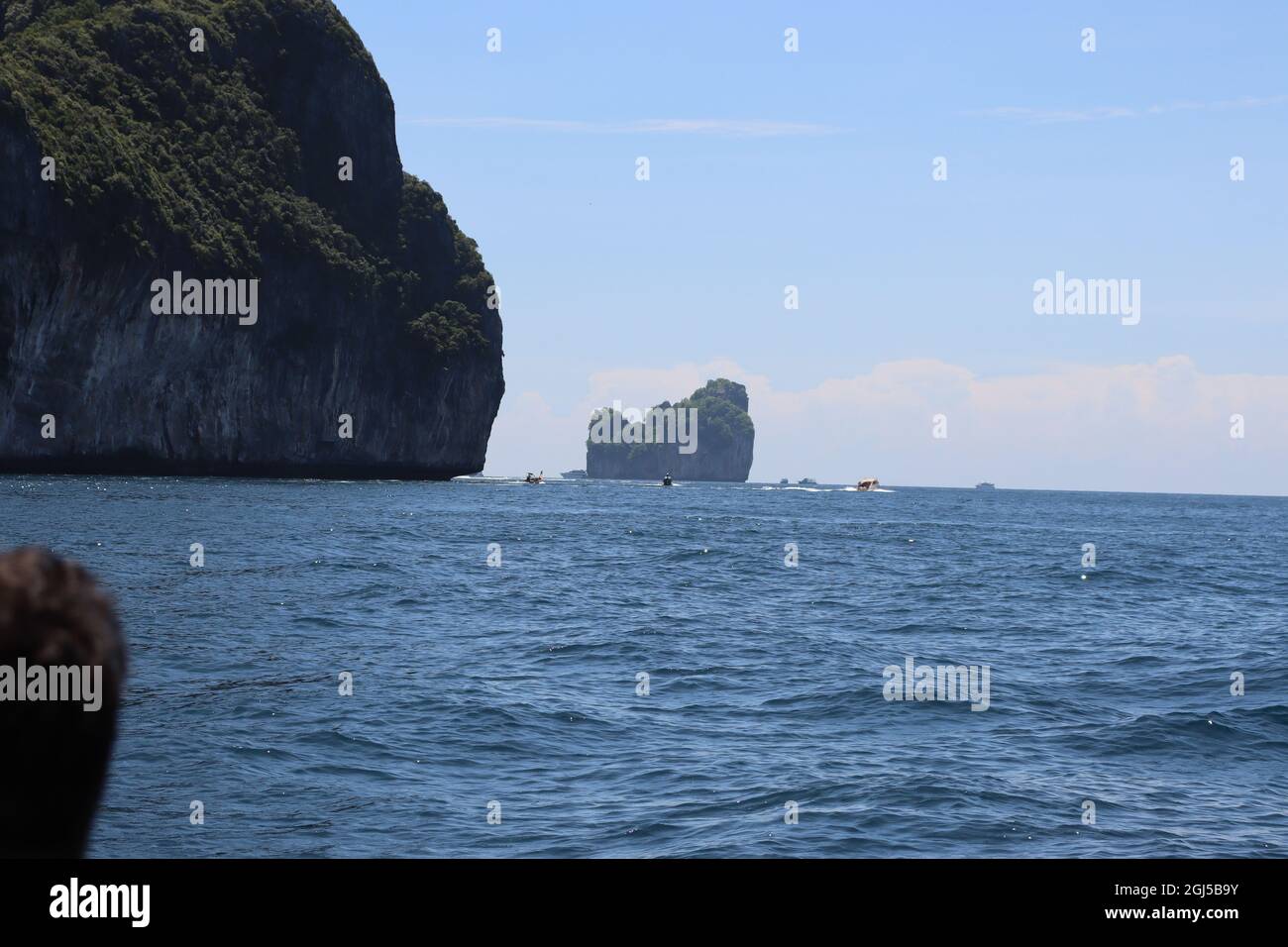 Boating near tropical islands waves and splashes Stock Photo - Alamy