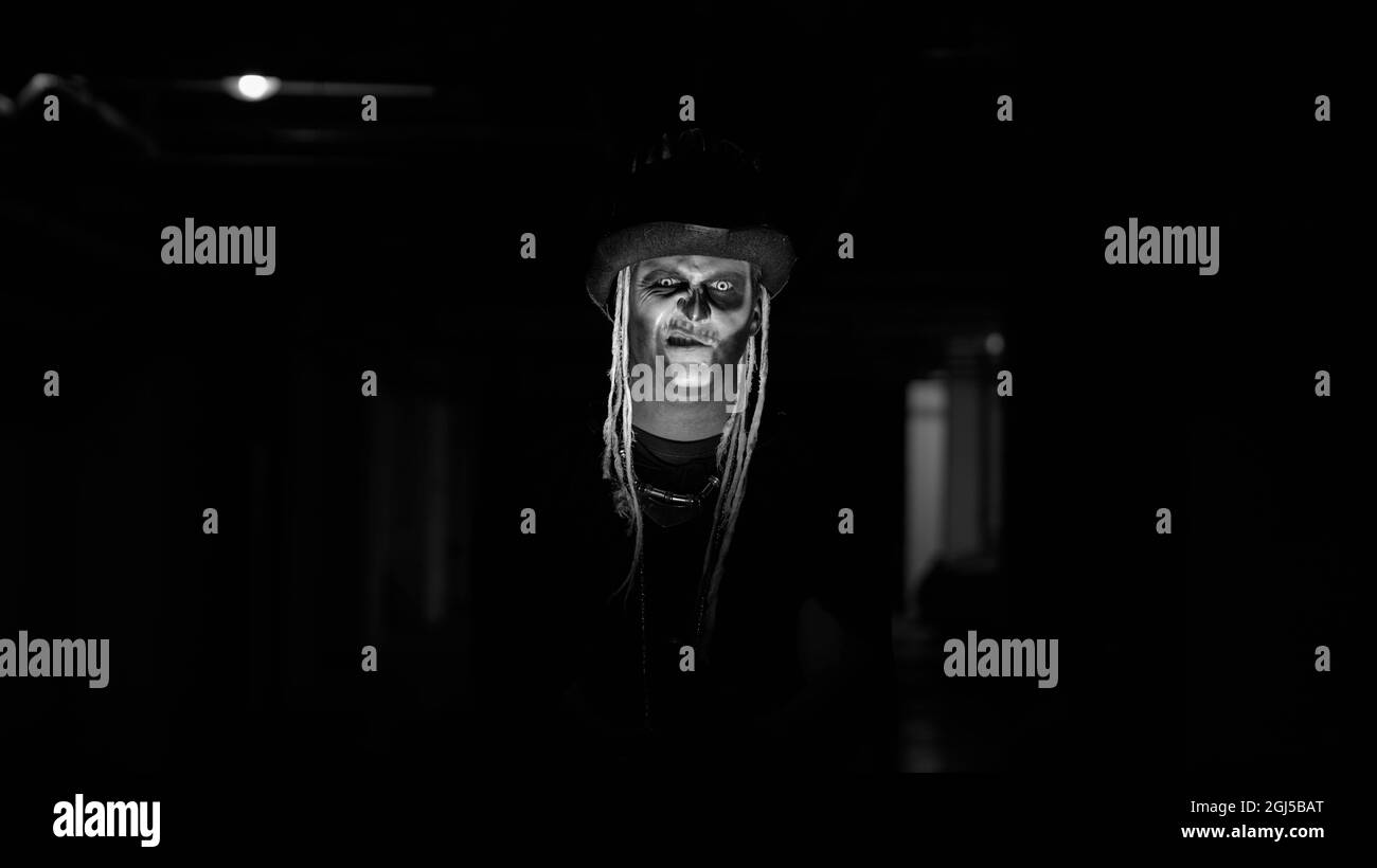 Frightening man in carnival skull Halloween makeup of skeleton looking ...